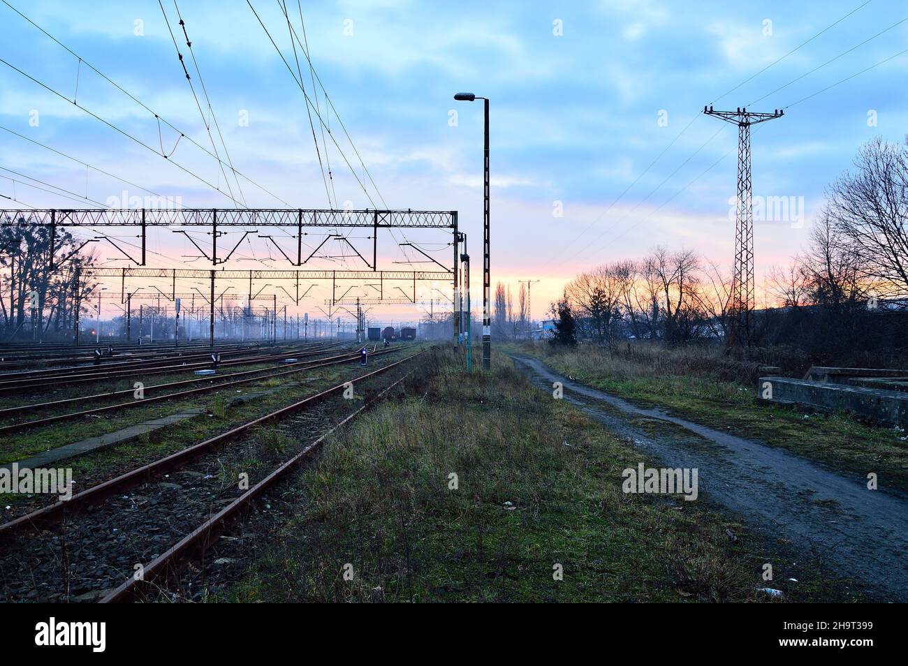 Railway infrastructure, tracks, rails and power cables over the tracks ...