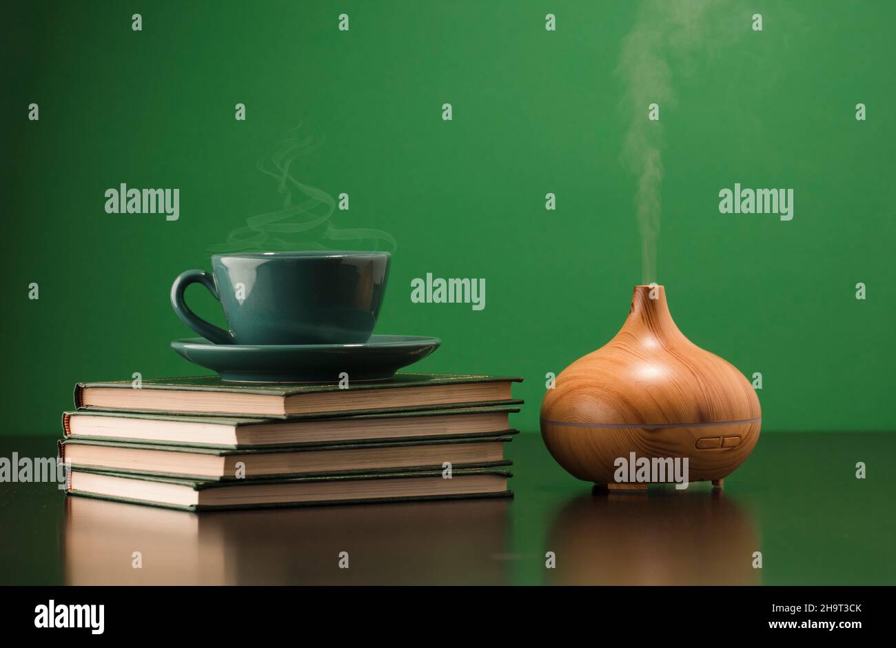 electric ultrasonic humidifier emitting atomized water droplets on a ...