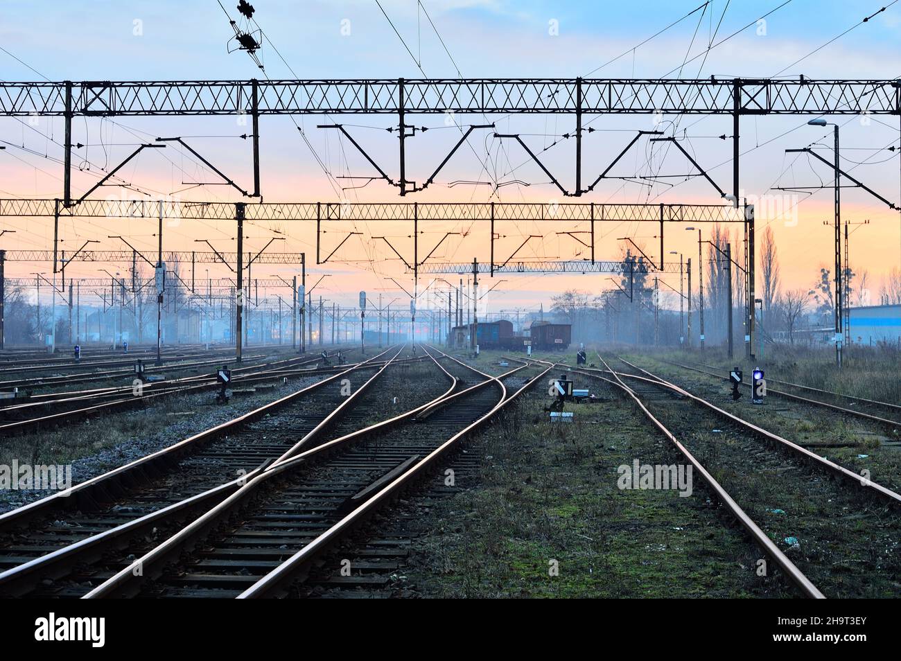 Railway infrastructure, tracks, rails and power cables over the tracks ...