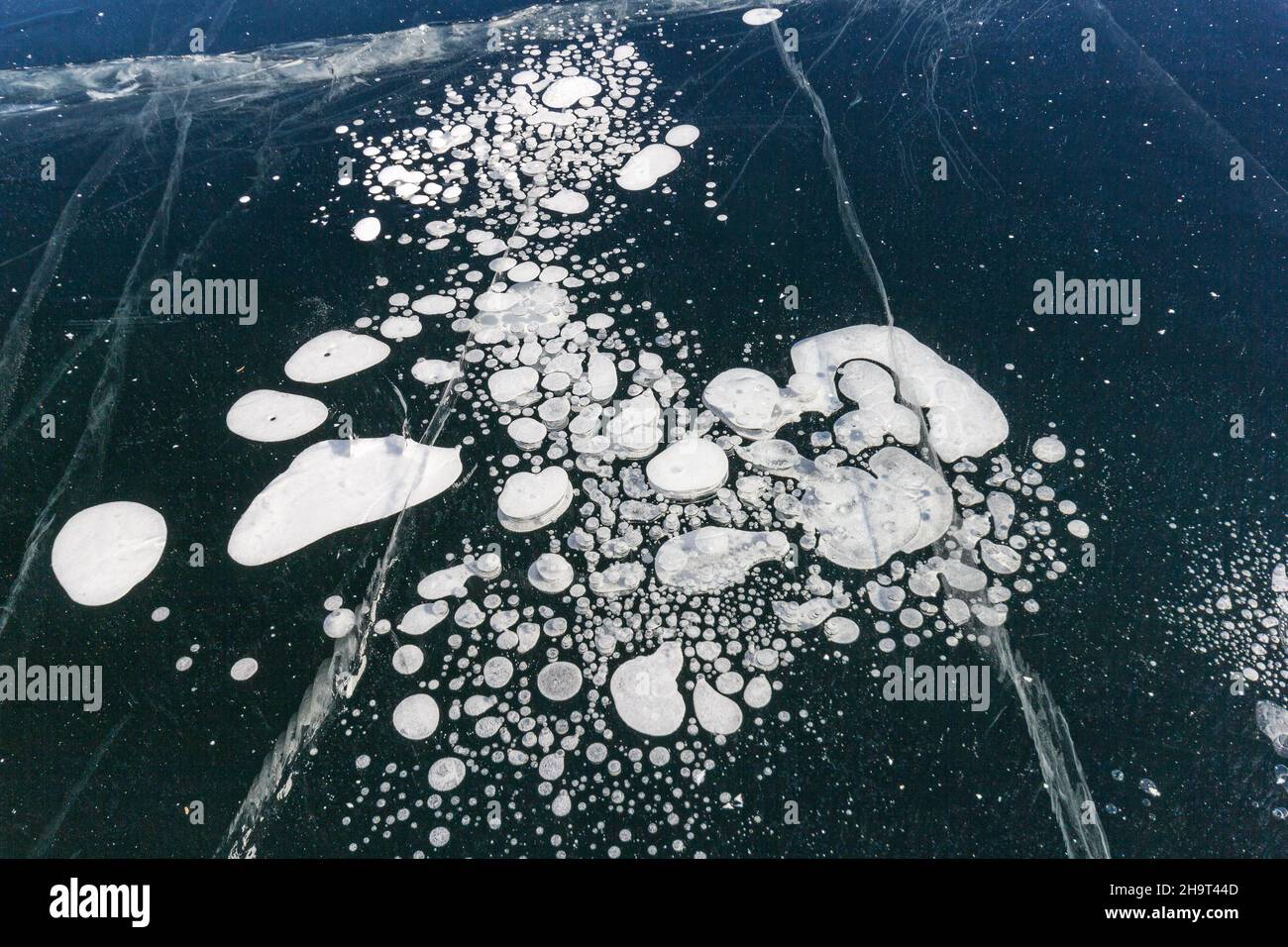 Trapped methane gas under the surface of the frozen lake from extreme ...