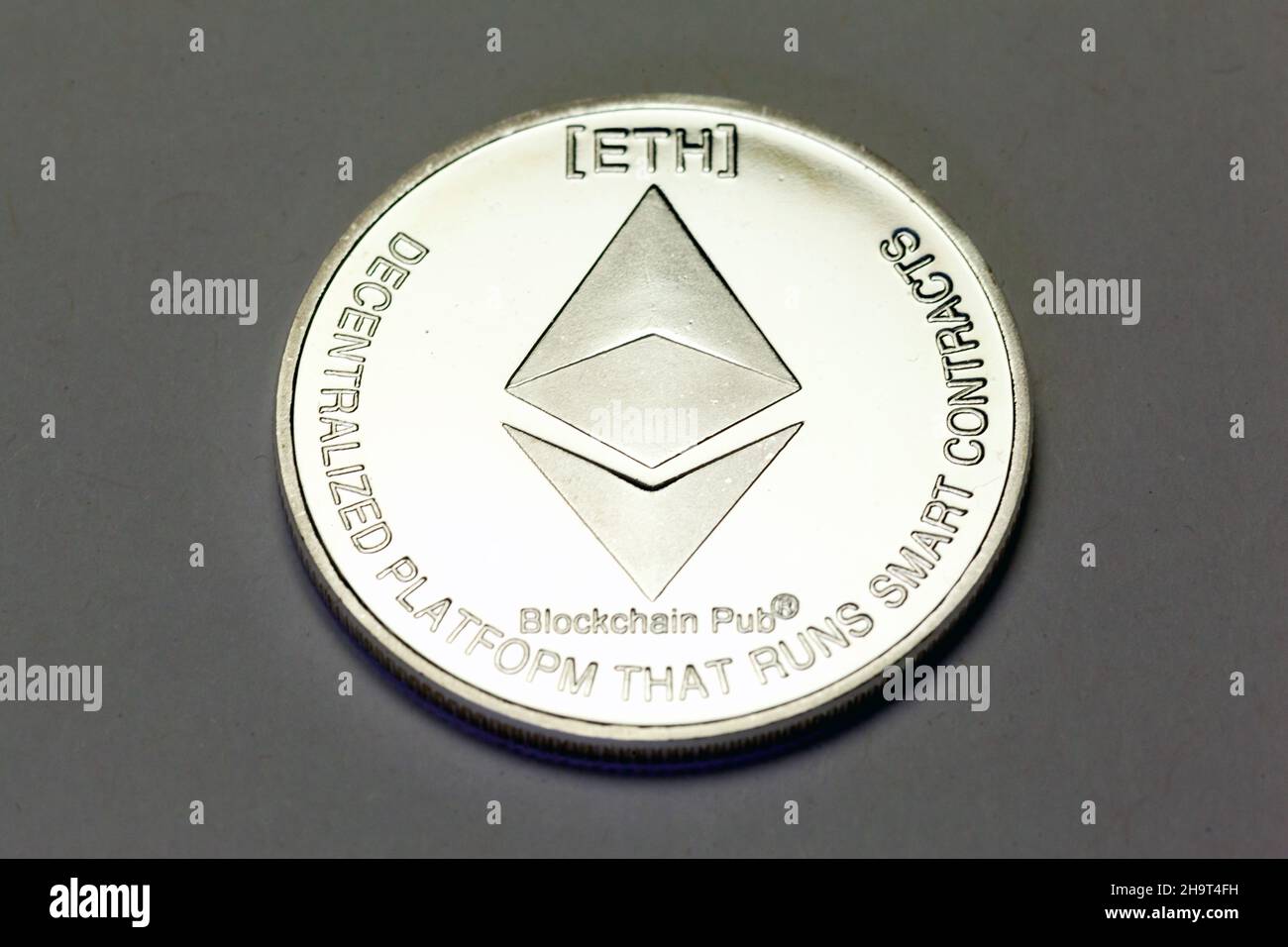Cryptocurrency Ethereum physical coin Stock Photo - Alamy