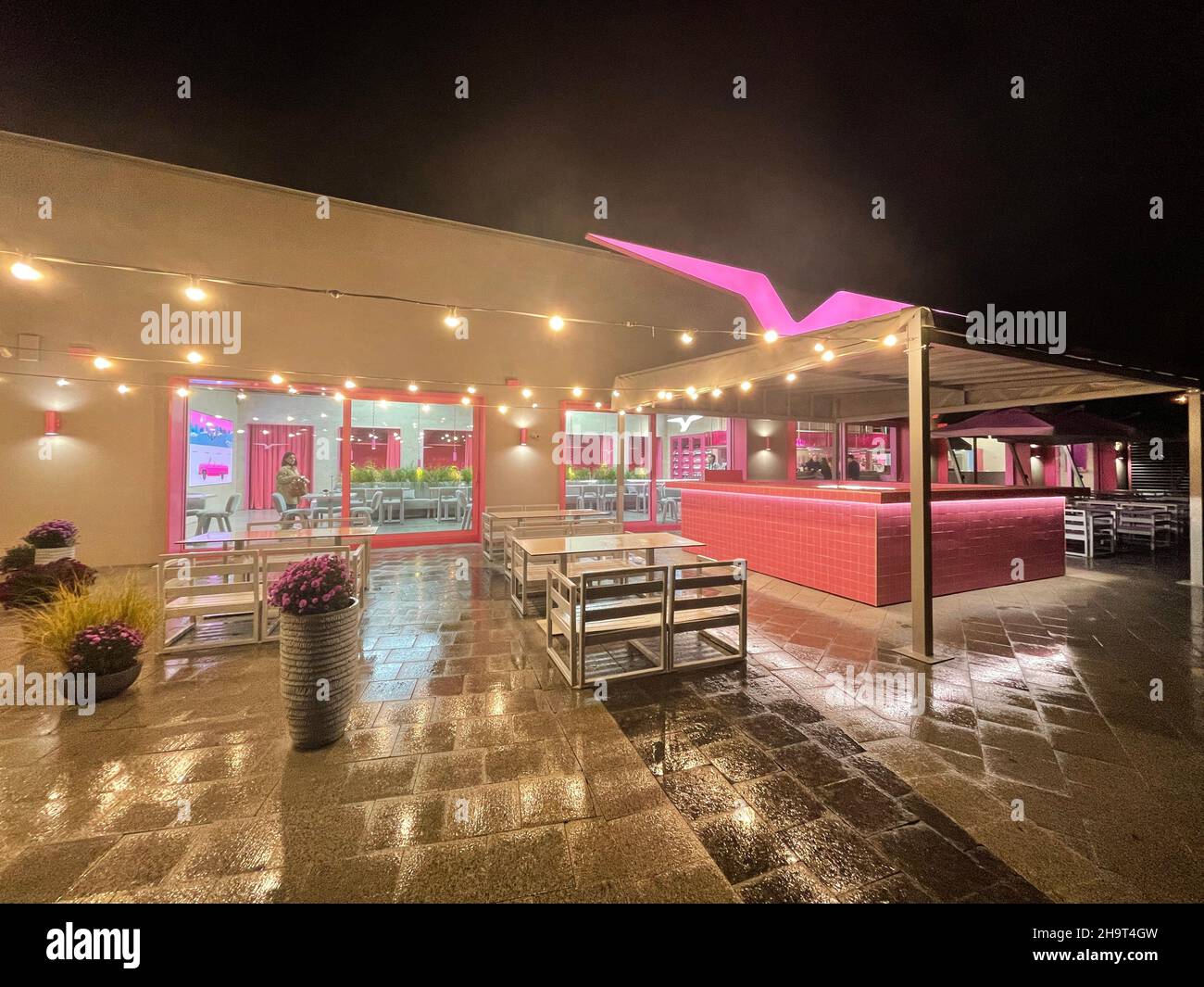 Terrace of a cozy retro styled cafe at night Stock Photo - Alamy