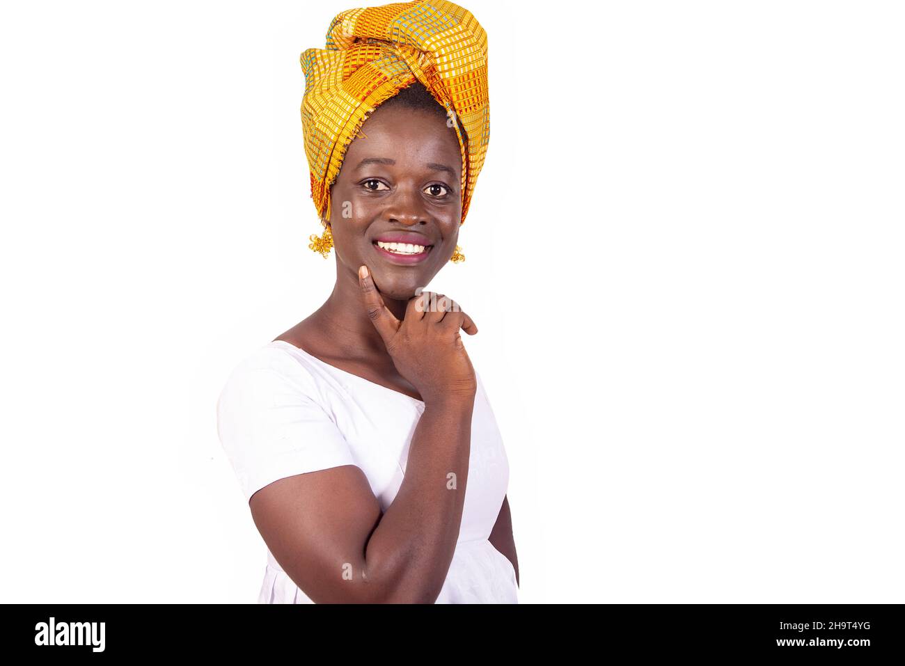Young woman with fingers on cheek hi-res stock photography and images ...