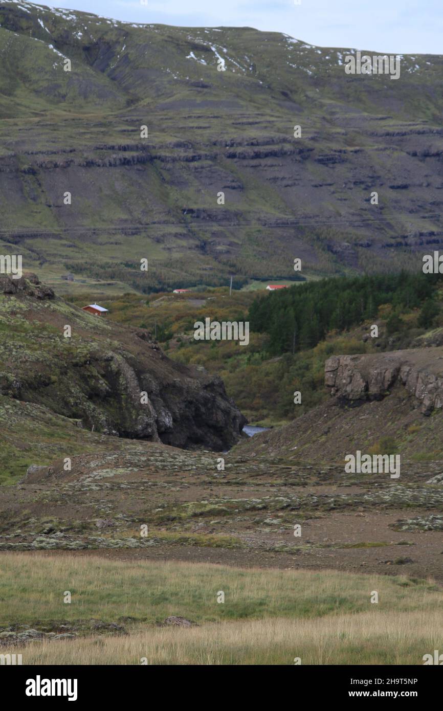 Vertical shot of the valley with the hill in the background Stock Photo ...