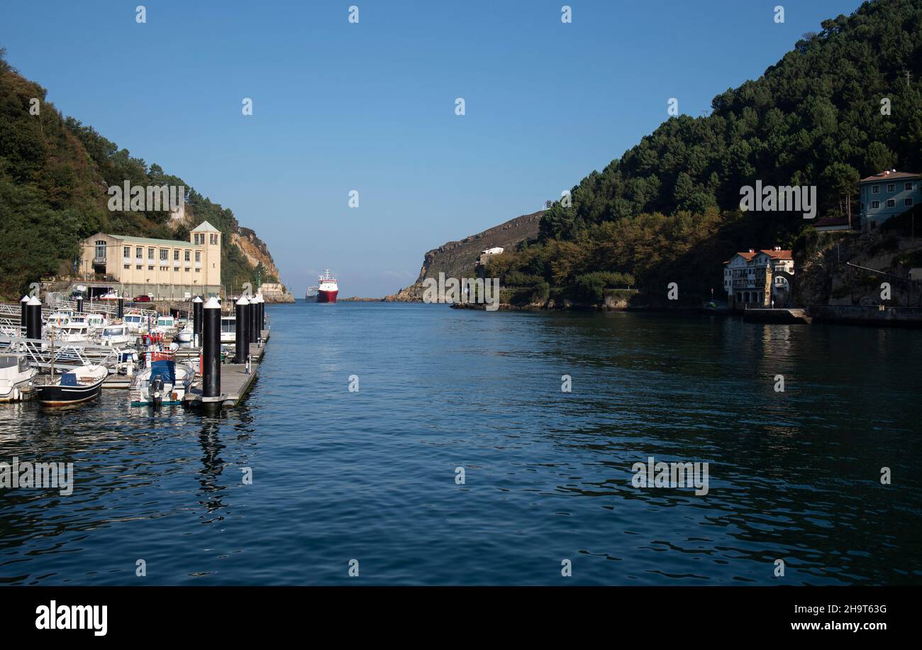 panoramic view of merchant ship entering port Stock Photo - Alamy