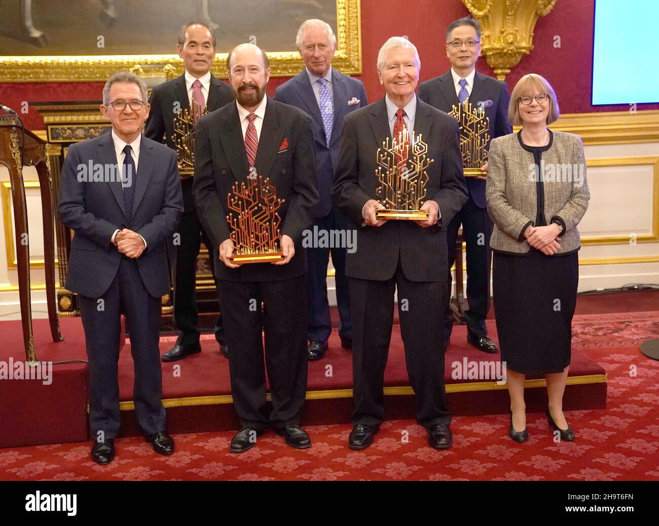 The Prince of Wales, (rear centre) on behalf of the Queen, poses with ...