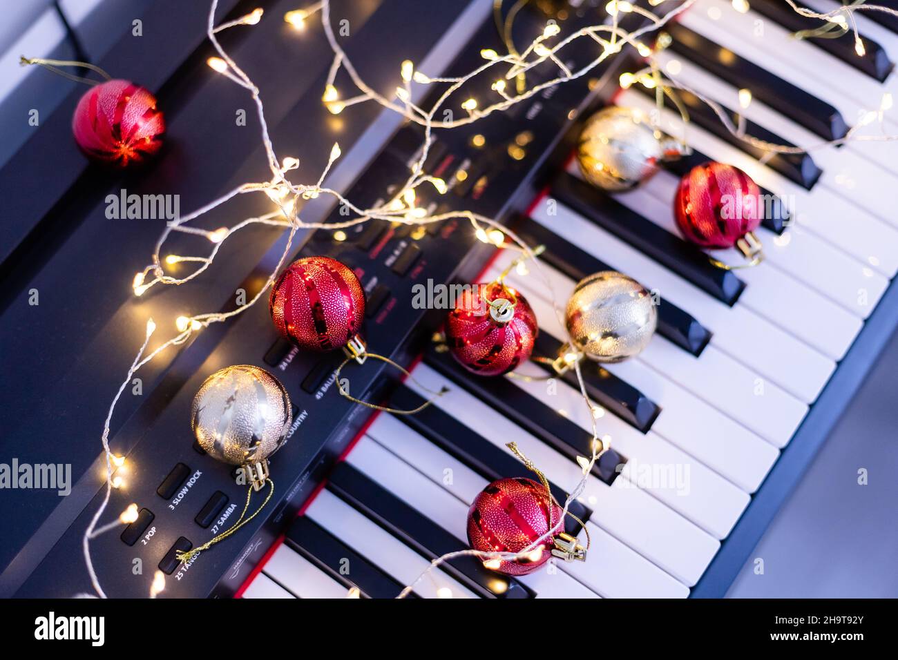 Piano keys with Christmas decorations, closeup Stock Photo - Alamy
