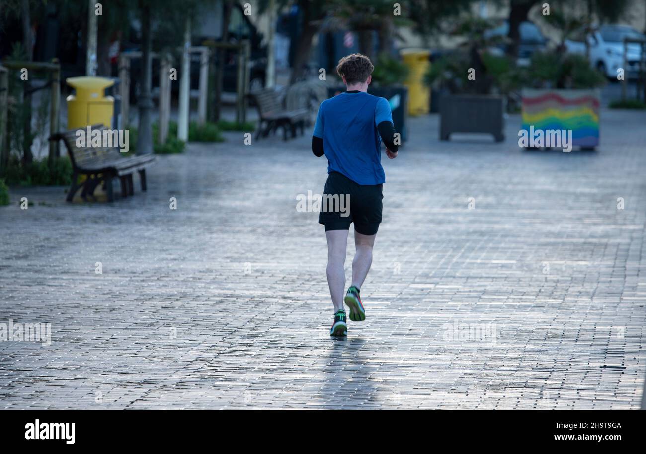 boy running on the street Stock Photo - Alamy