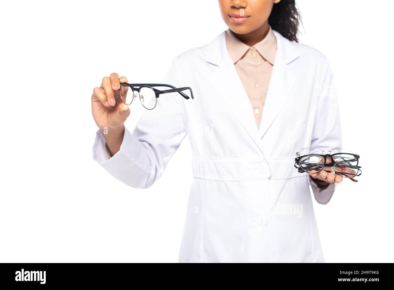 Cropped view of african american doctor holding eyeglasses in hands ...