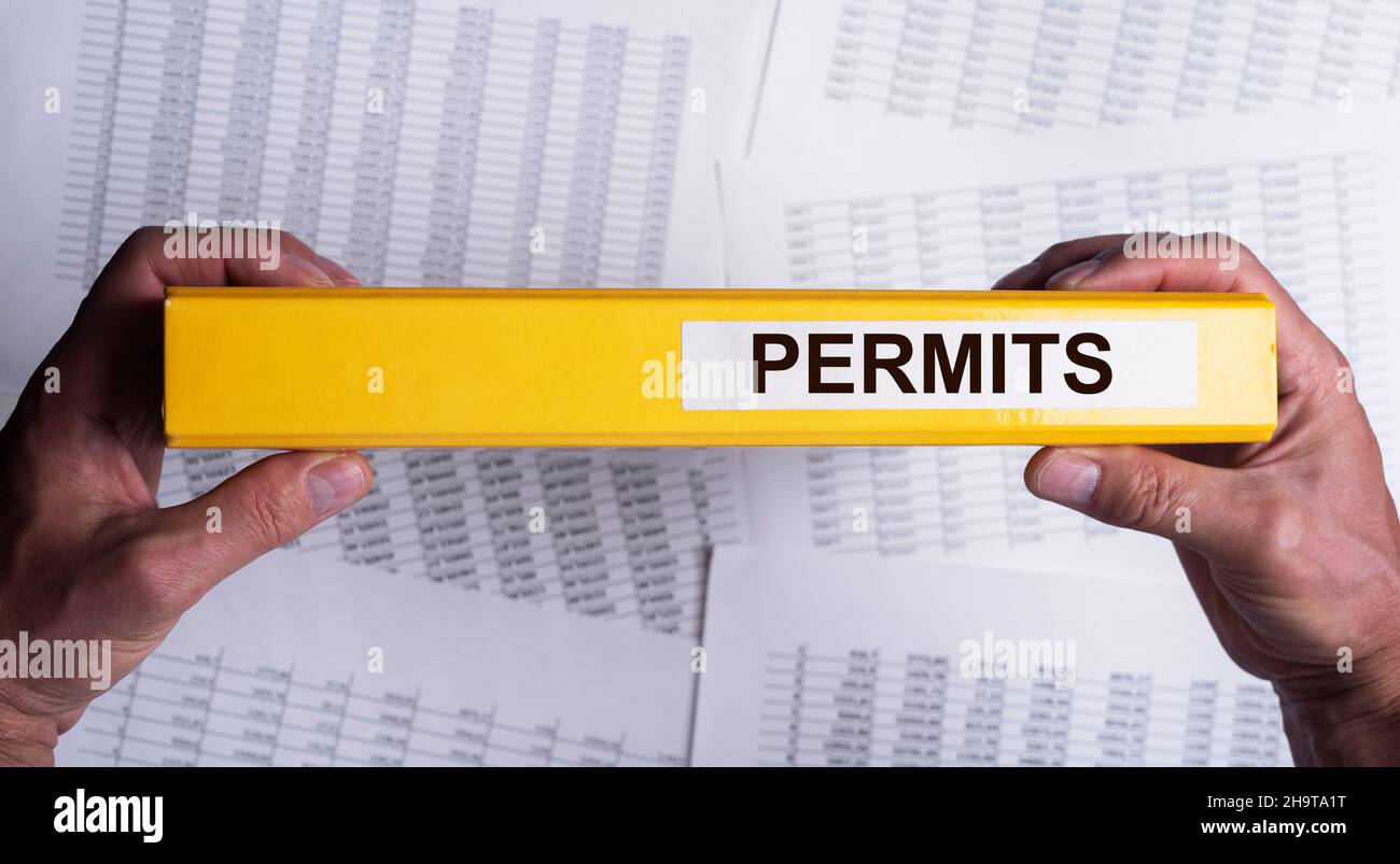 Hands with Permits folder. Permission and approval concept Stock Photo ...