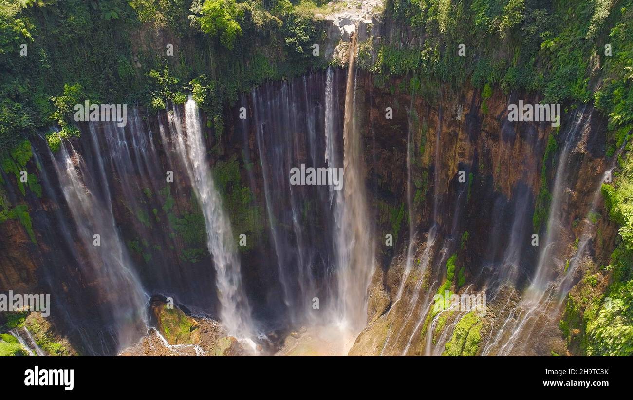 beautiful waterfall Coban Sewu in tropical forest, Java Indonesia ...