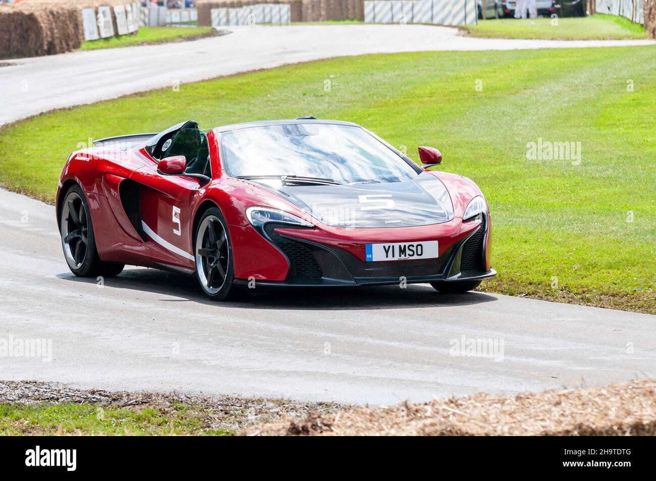 McLaren 650S Can-Am driving up the hill climb at the Goodwood Festival ...