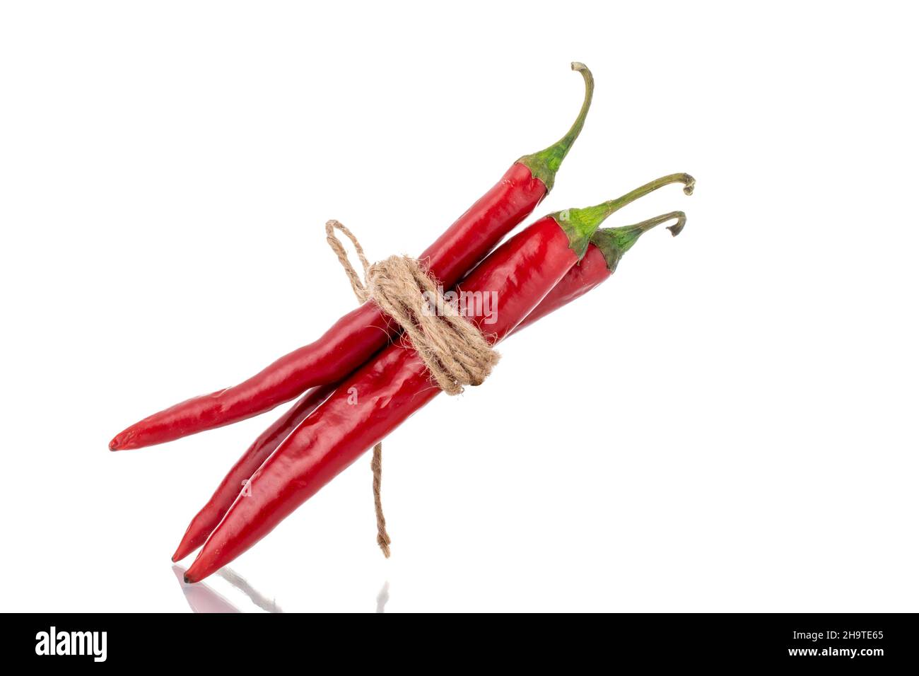 Three pods of hot red pepper, close-up, isolated on white Stock Photo ...