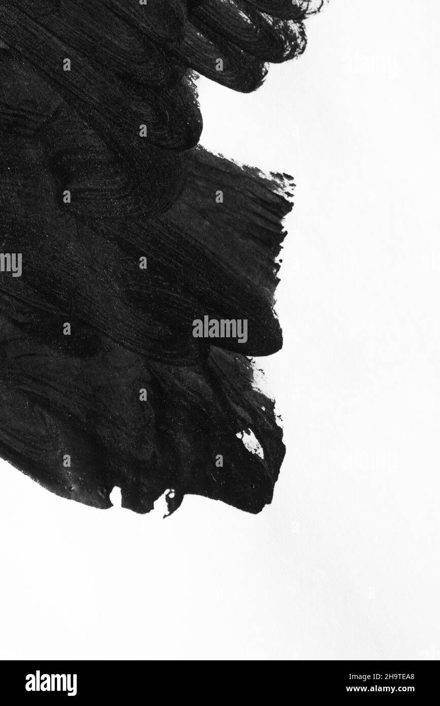 Black brush strokes on white paper isolated Stock Photo - Alamy
