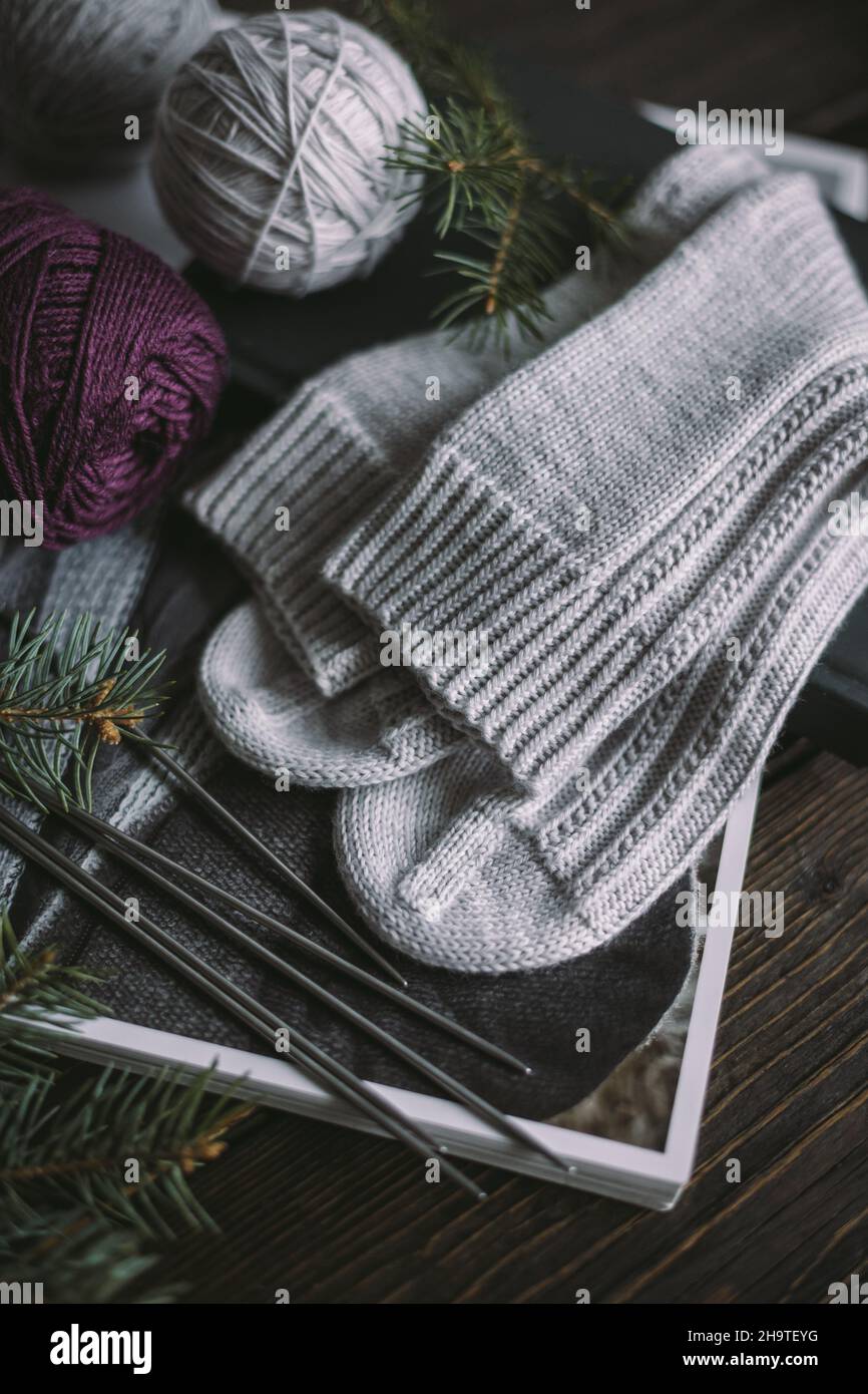 Hand knitting socks with needles and yarn balls. Concept for handmade ...