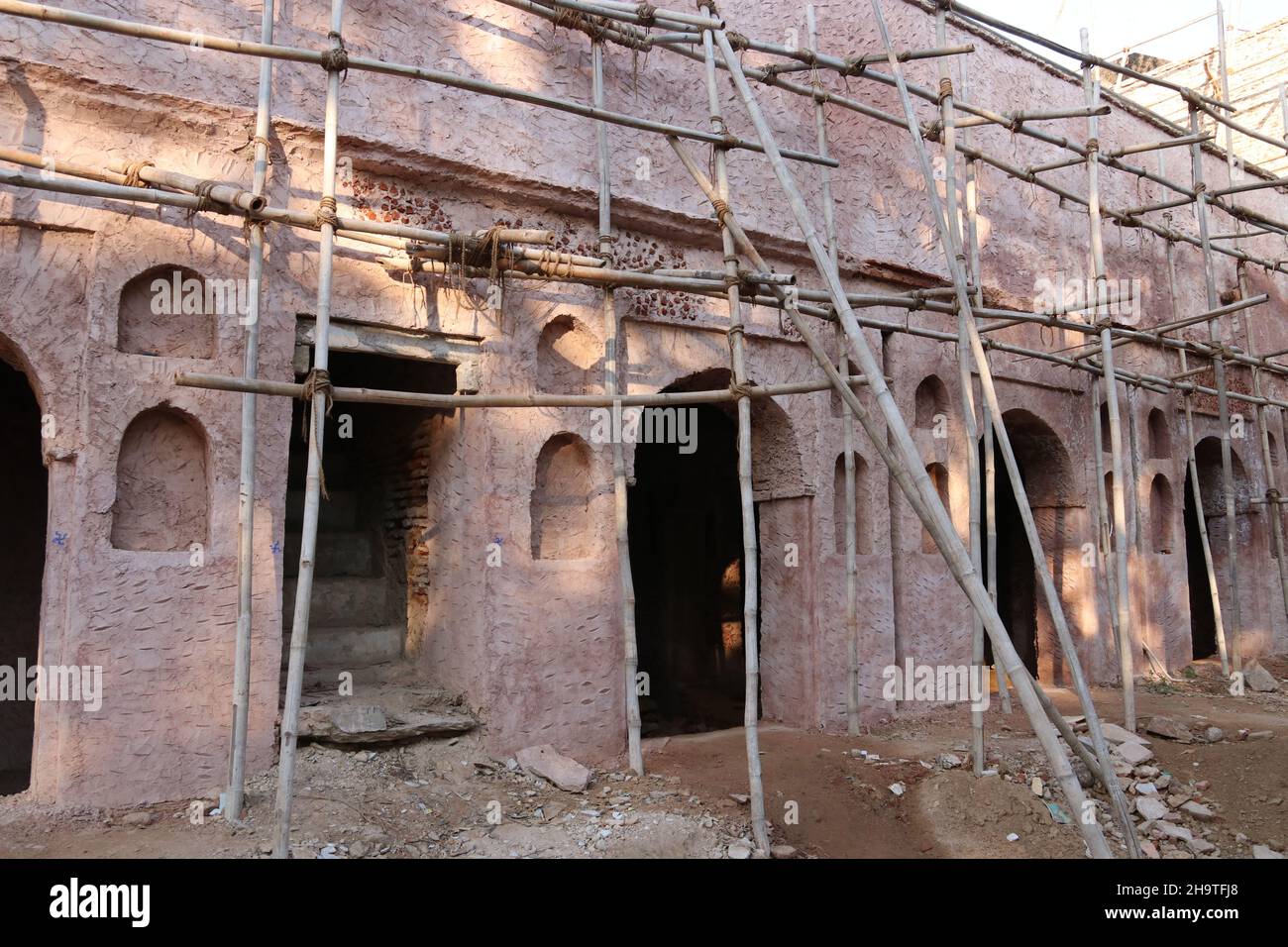 Reconstruction of an ancient fortress in Haryana, India. Scaffolding ...