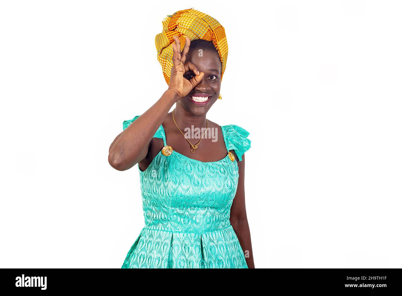 beautiful young woman wearing traditional holding, looking through a ...