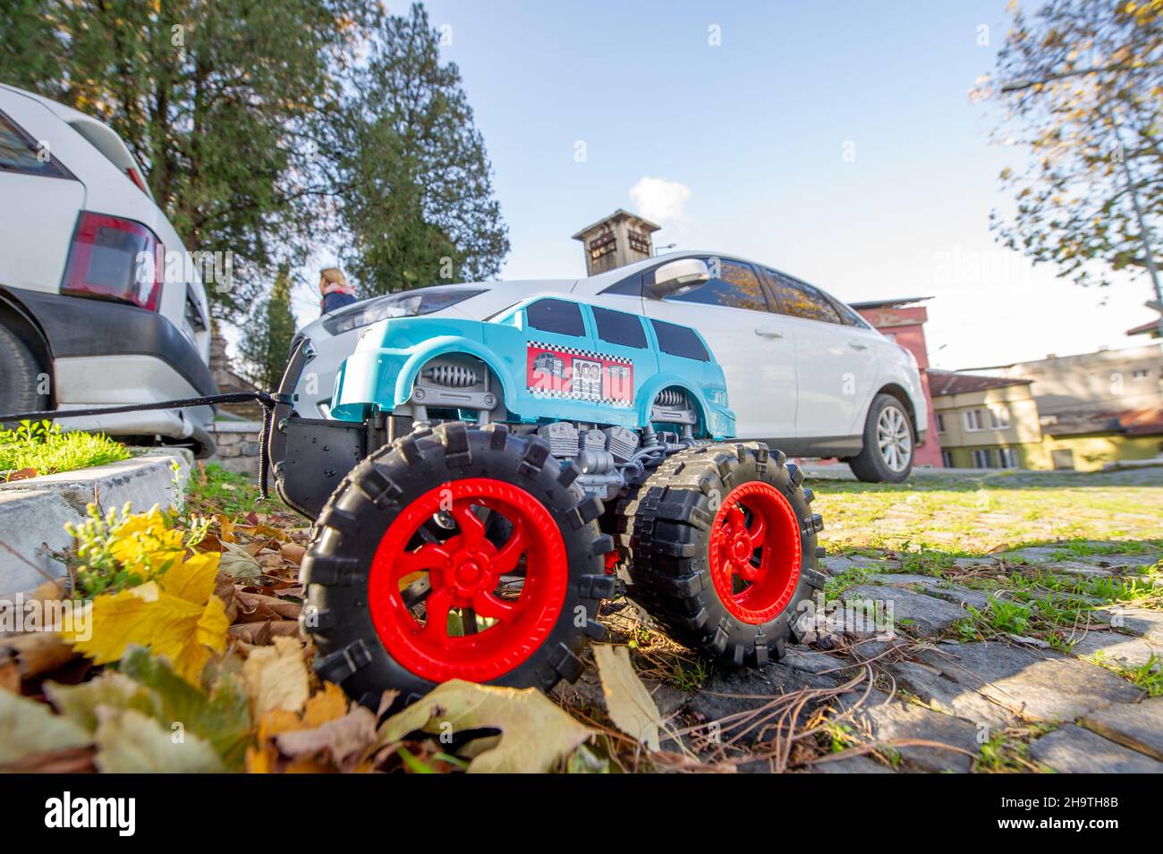 Toy car parked in normal car park Stock Photo - Alamy