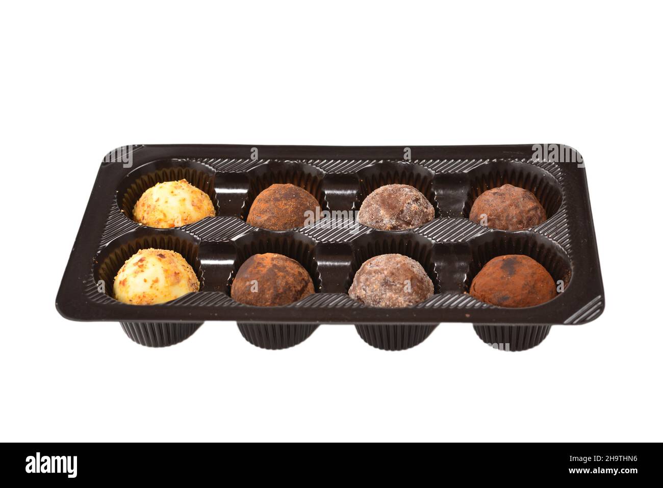 Chocolate candy collection in plastic box Stock Photo - Alamy