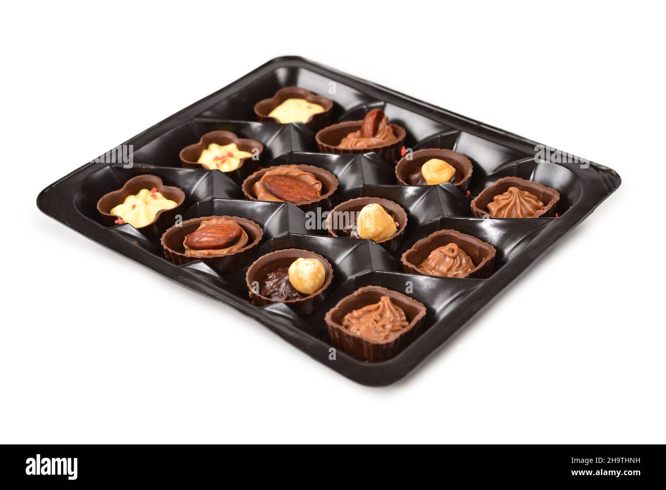 Chocolate candy collection in plastic box Stock Photo - Alamy