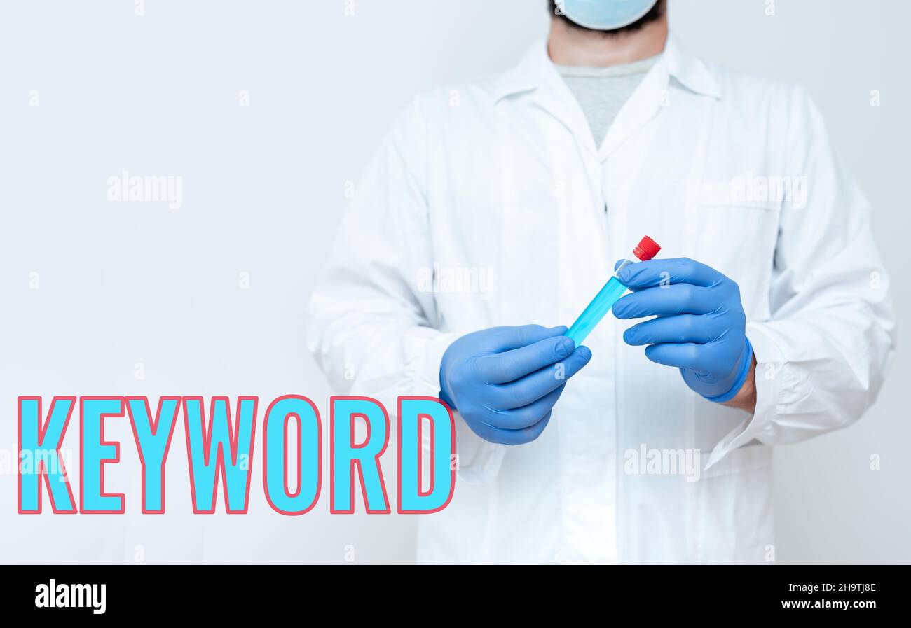 Hand writing sign Keyword. Word Written on word which acts as the key ...