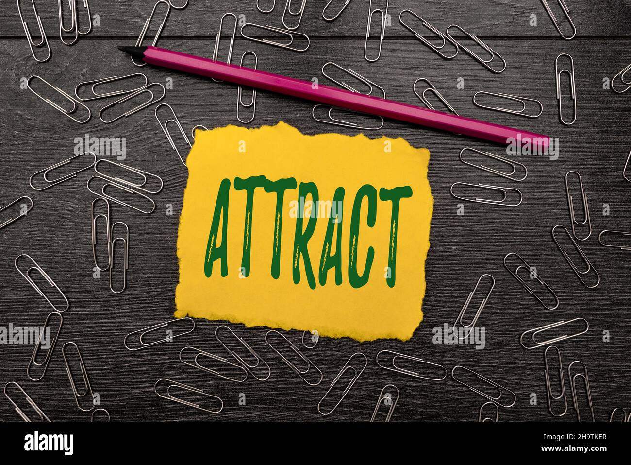 Text sign showing Attract. Business concept to draw by a physical force ...