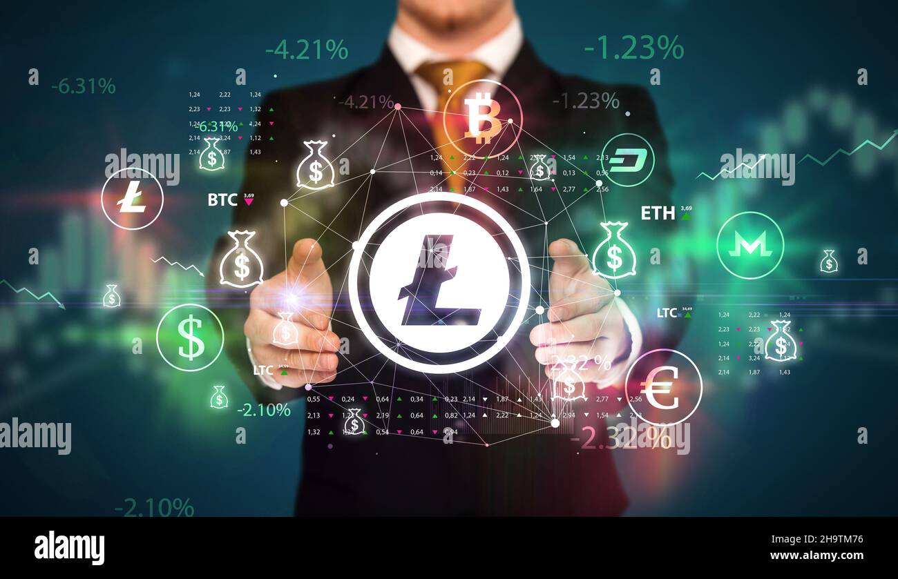 Businessman holding currency symbols concept Stock Photo - Alamy