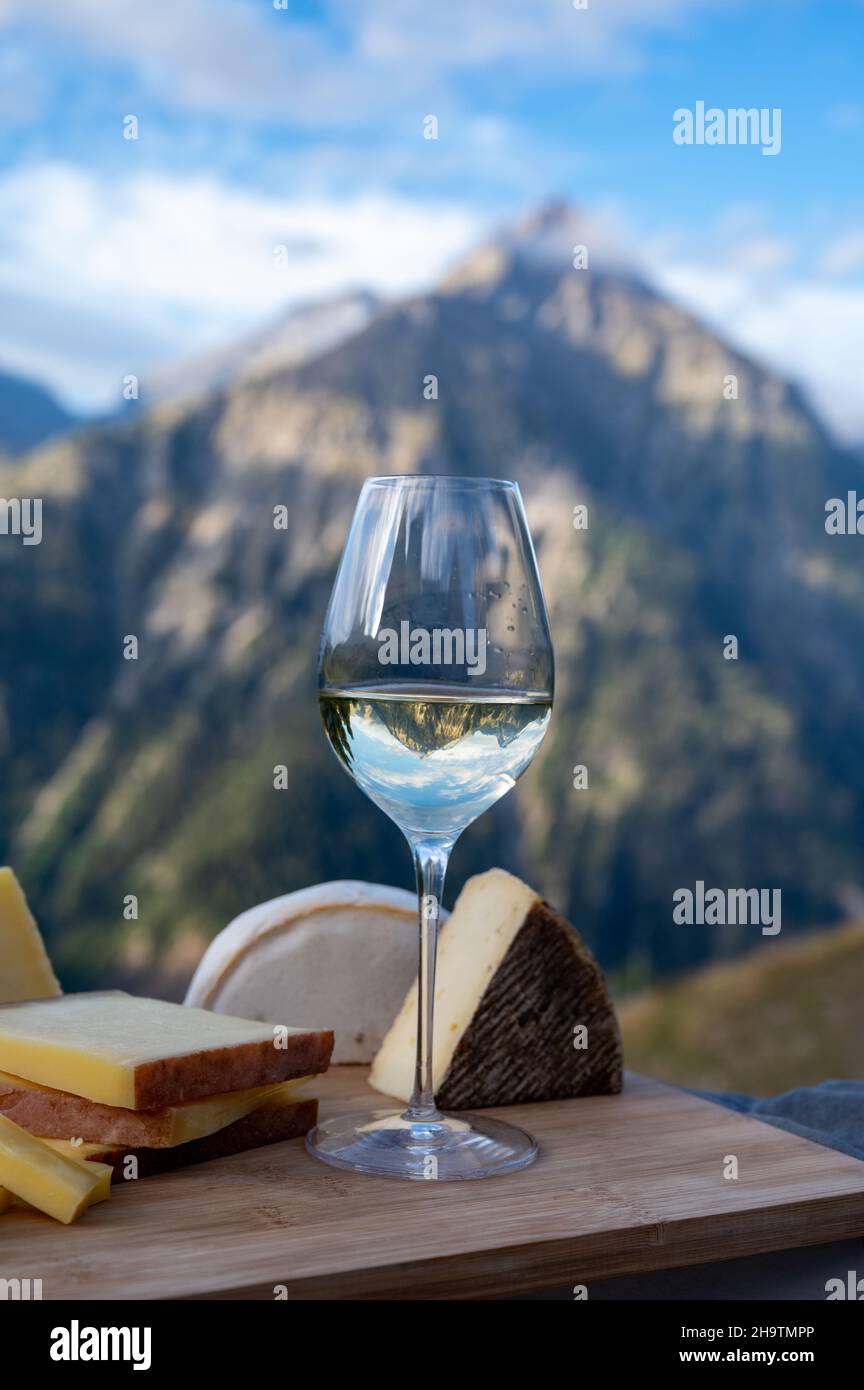 Tasty cheese and wine from Savoy region in France, beaufort, abondance ...