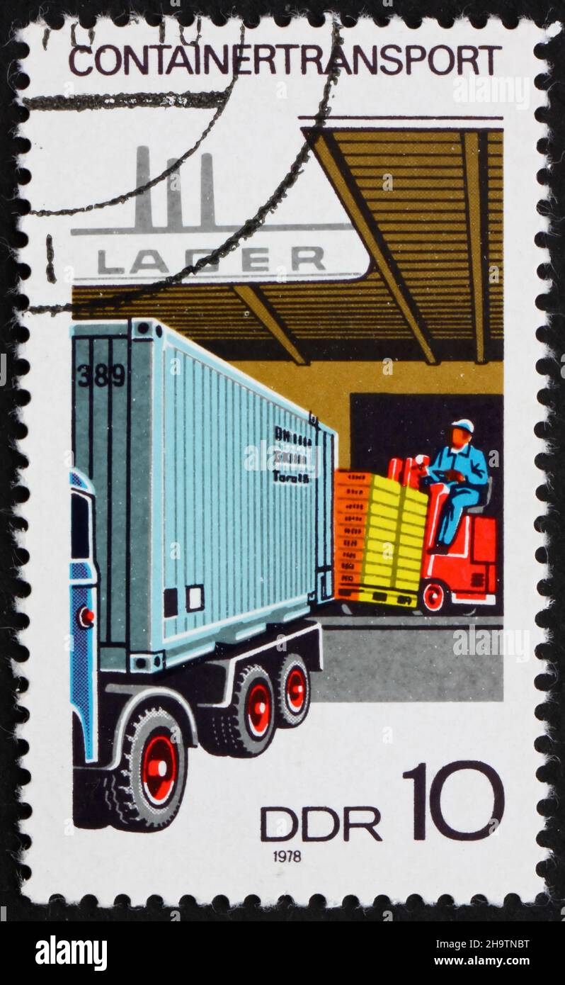 GDR - CIRCA 1978: a stamp printed in GDR shows Loading Container on ...