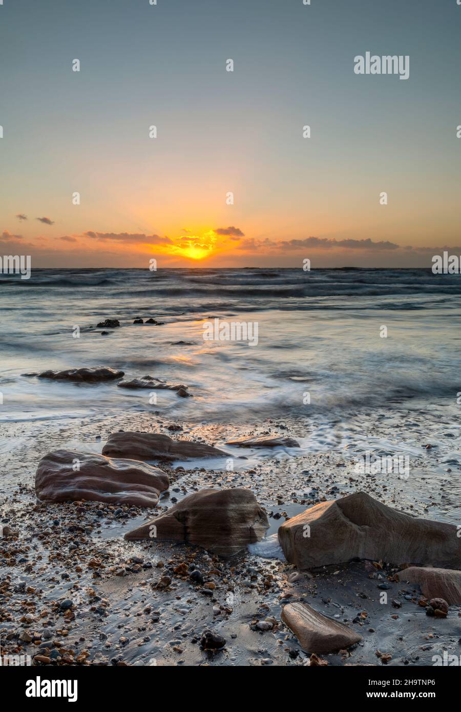 sunset over compton bay on the isle of wight coastline, isle of wight ...