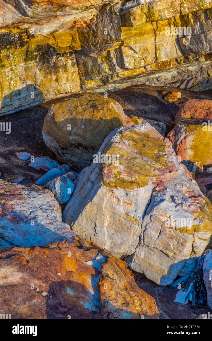 colourful sandstone rocks on the coastline of the isle of wight, isle ...