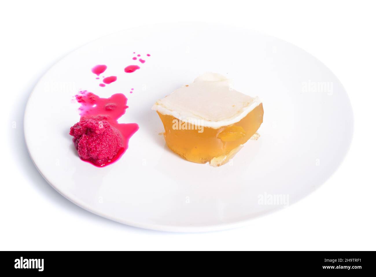 Jelly broth on white plate Stock Photo - Alamy