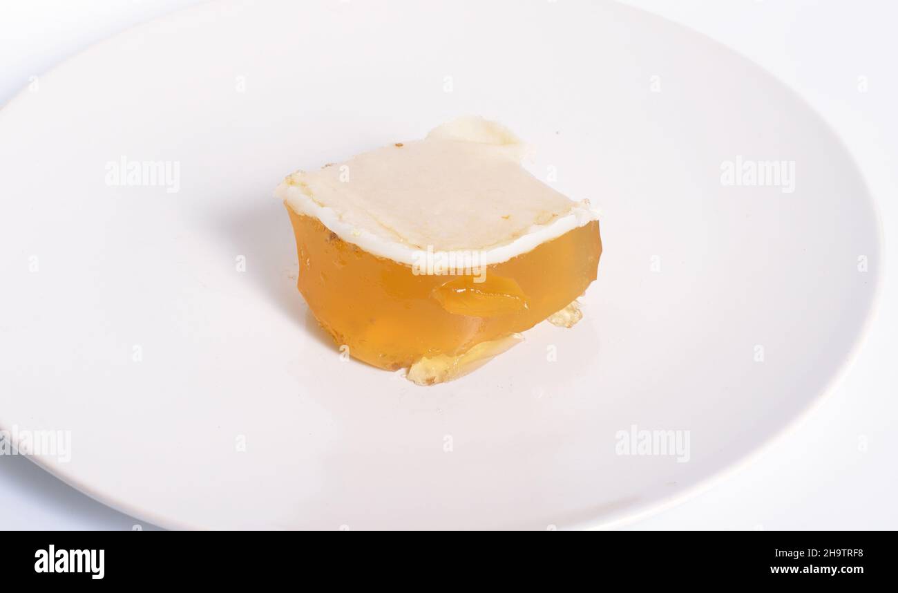 Jelly broth on white plate Stock Photo - Alamy