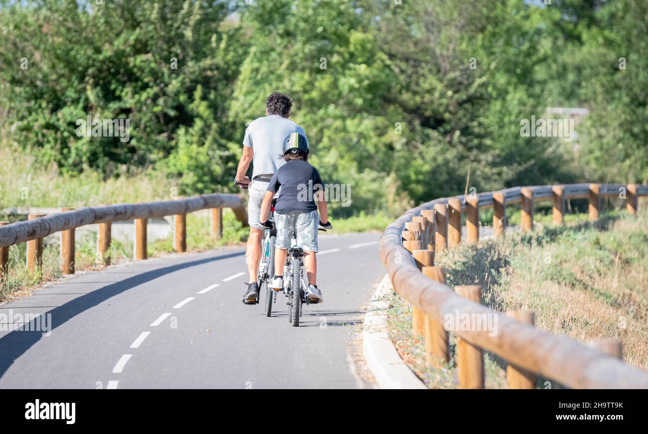 Bike path with people on bicycles Stock Photo - Alamy