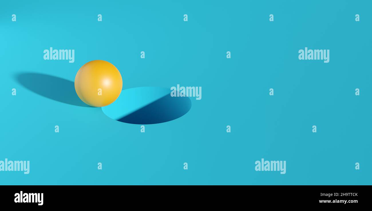 Yellow sphere on edge of hole on cyan background, target or goal ...