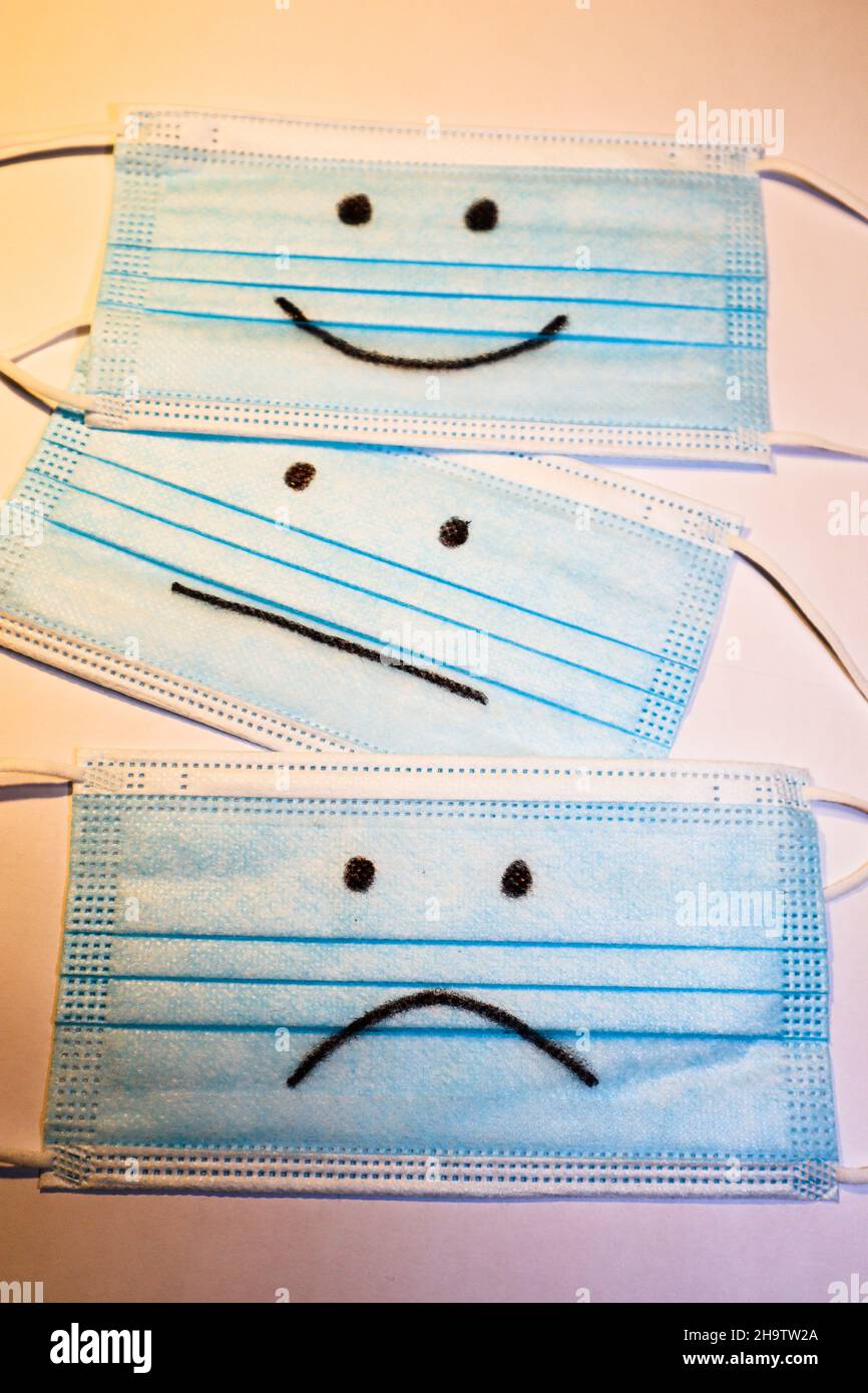 virus medical face masks with happy and unhappy smiling faces Stock ...
