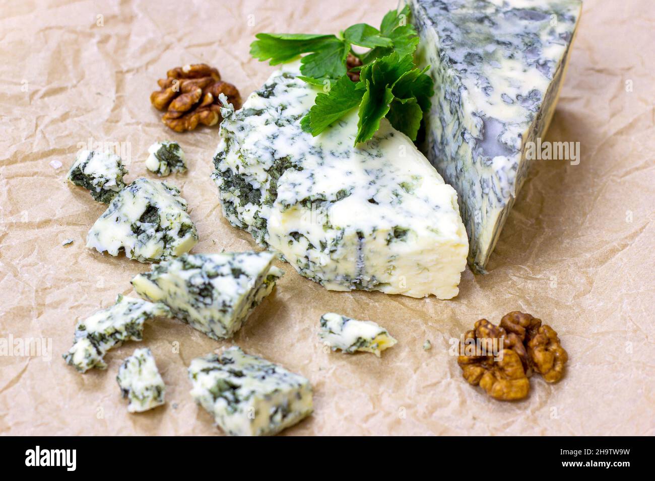 Slices and triangles of Danish Blue (dorblue) cheese with mold on a ...