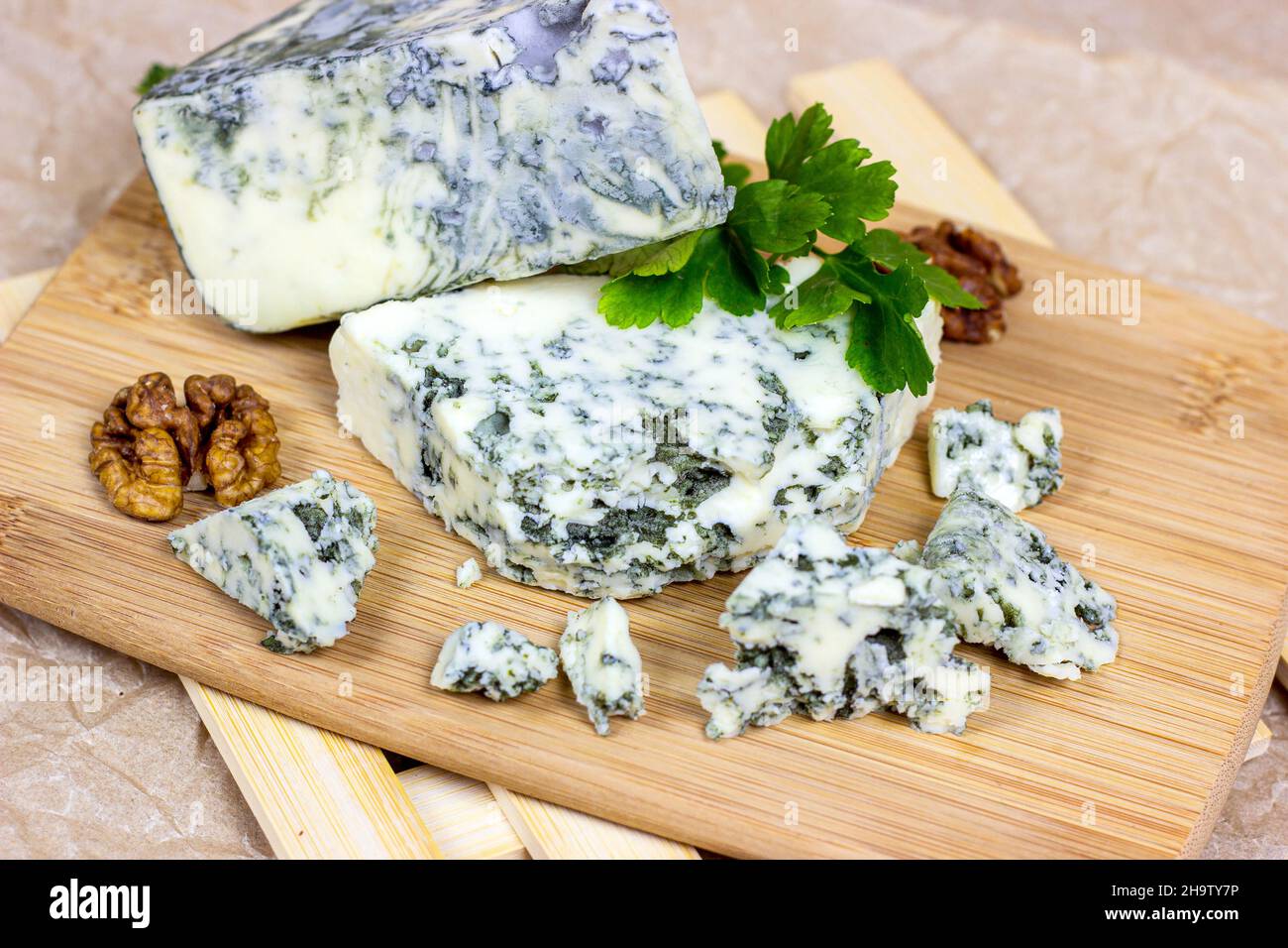 Slices and triangles of Danish Blue (dorblue) cheese with mold on ...