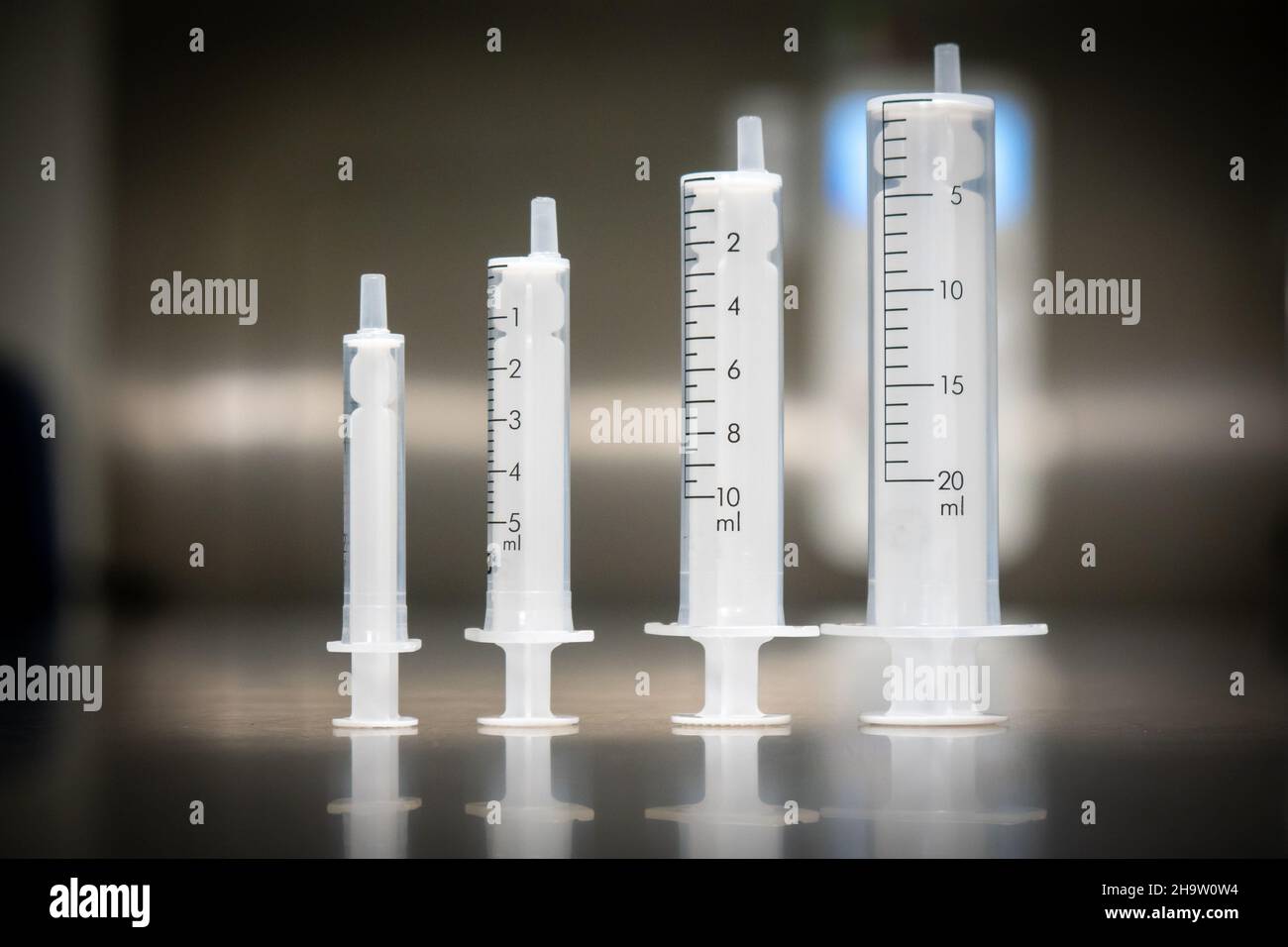 different size medical syringes stand next to each other Stock Photo ...