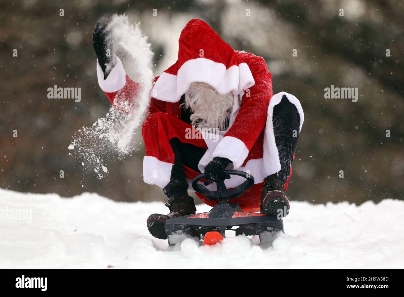 Dressed as santa riding sleigh hi-res stock photography and images - Alamy