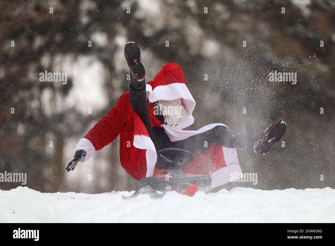 "09.02.2021, Germany, , Berlin - Santa Claus falls from his sleigh ...