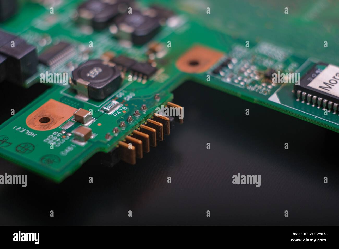 Part of an electronic printed circuit board with many electrical ...