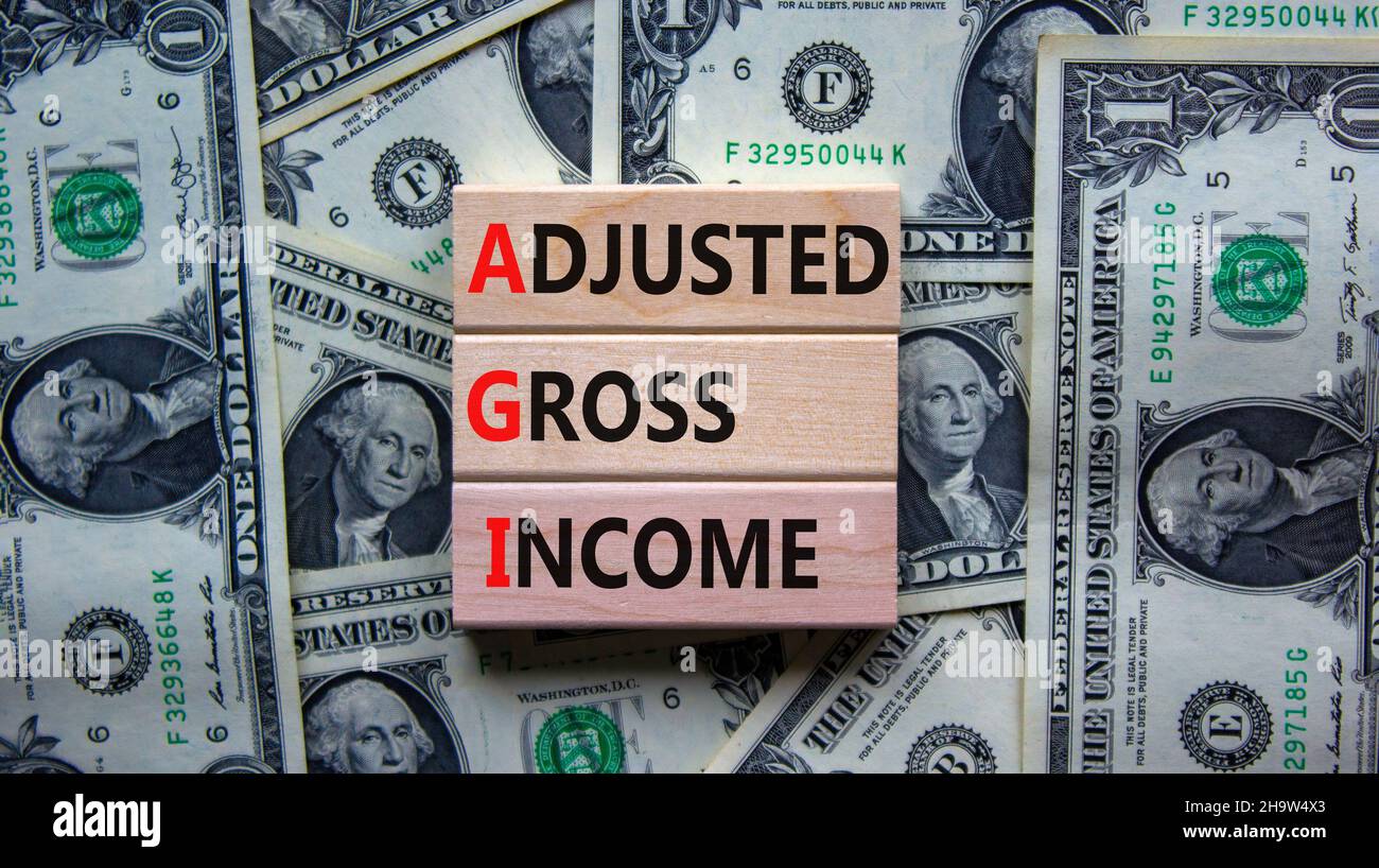 AGI adjusted gross income symbol. Concept words AGI adjusted gross ...