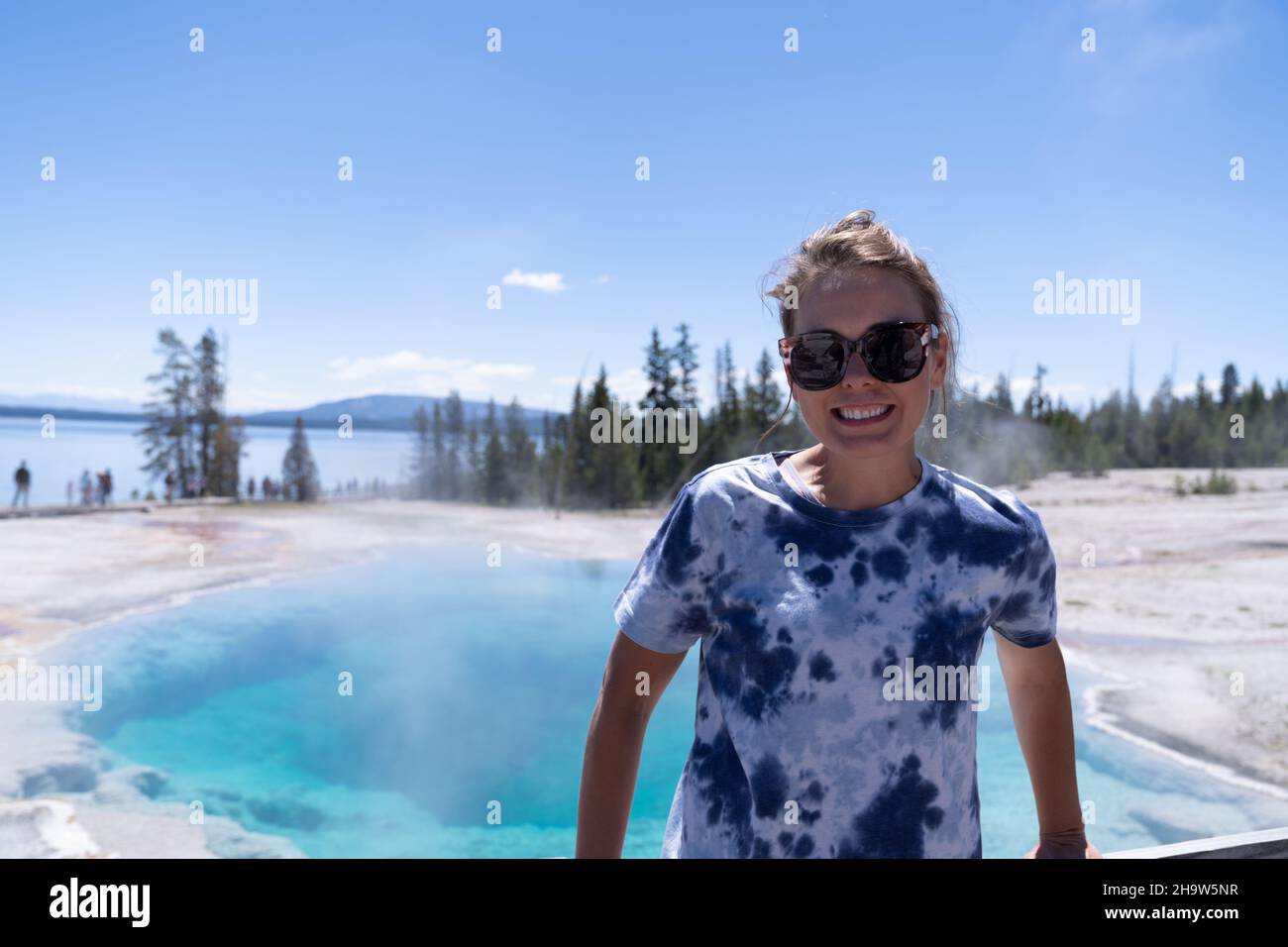 Tourist woman poses at West Thumb Geyser Basin in Yellowstone National ...