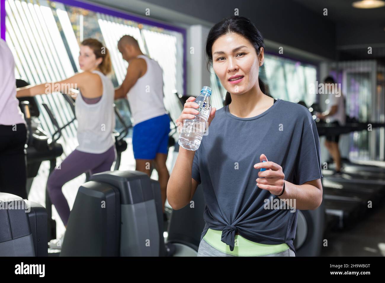 Japanese woman standing gym smiling hi-res stock photography and images ...