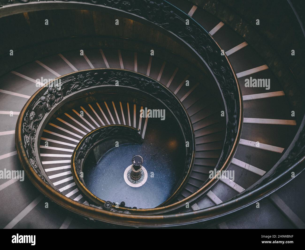 Beautiful long spiraling staircase Stock Photo - Alamy