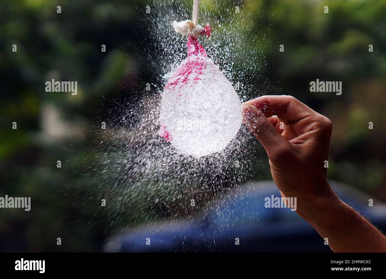 Balloon Burst pink water splash Stock Photo - Alamy