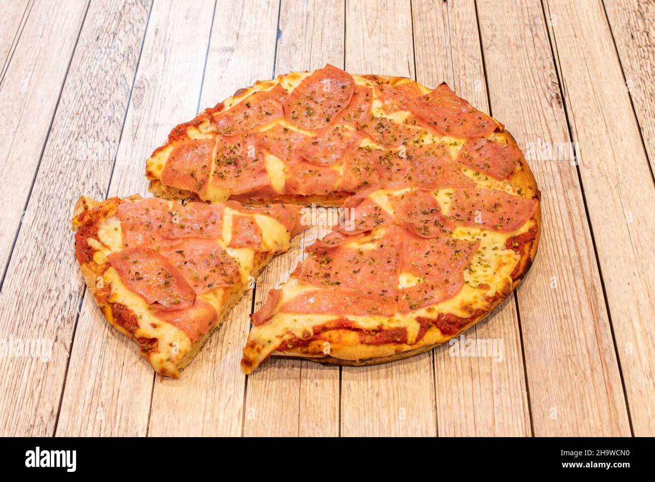 Delicious ham and cheese pizza with lots of ham and lots of cheese ...