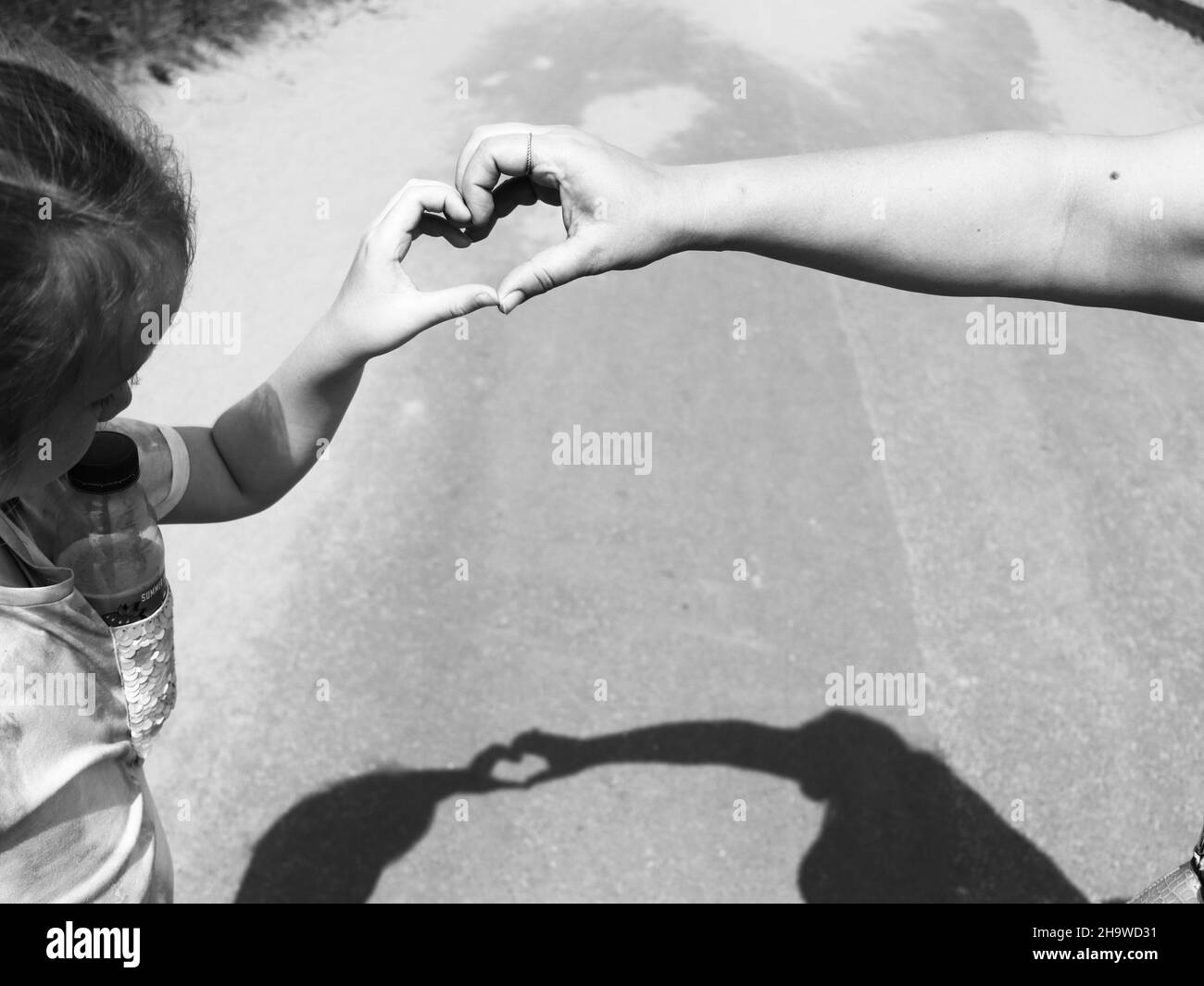 Shadow two hands forming heart hi-res stock photography and images - Alamy