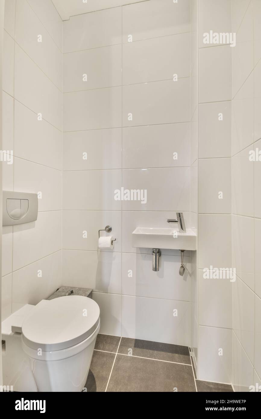 Interior of small clean restroom in miniature style Stock Photo - Alamy